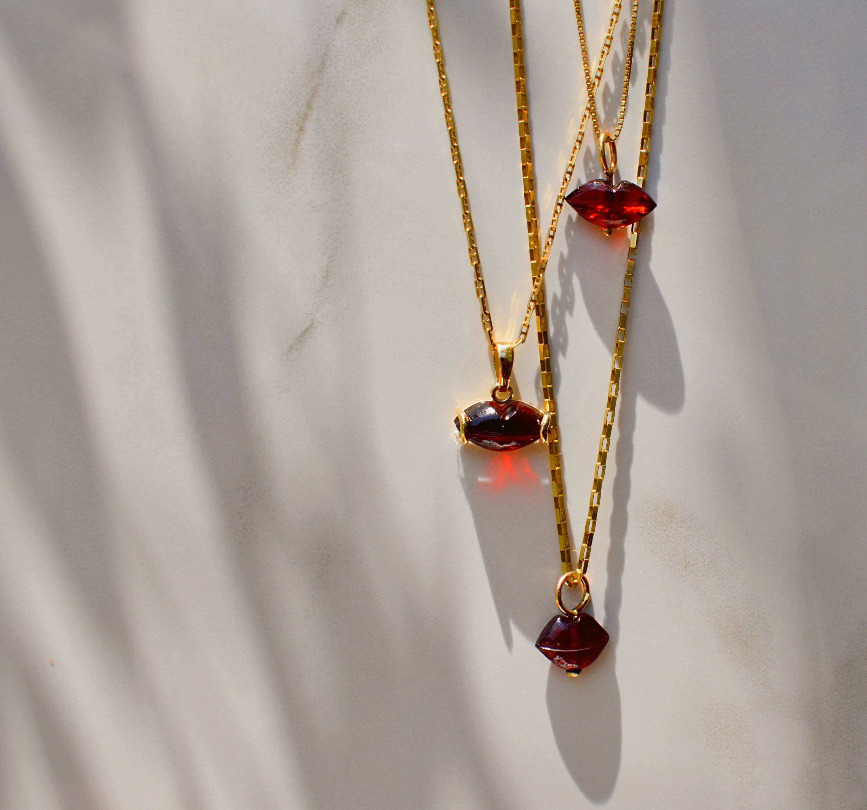 Sunkist Park (The Lip-Shaped Garnet Charm) – The Bold Gold
